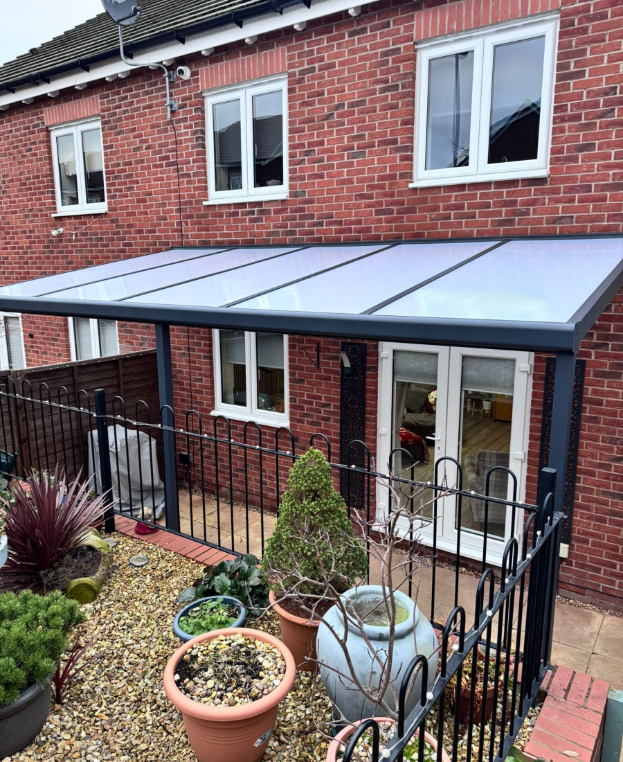 A fabulous Nebbiolo Aluminium Veranda in Gun Metal Grey and an Opal Polycarbonate Roof has been ...